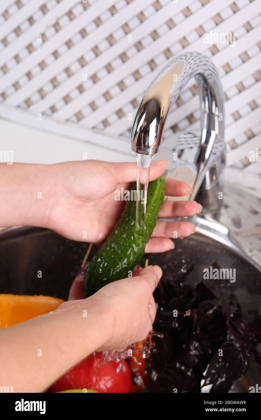 Woman washing various vegetables hi-res stock photography and images ...