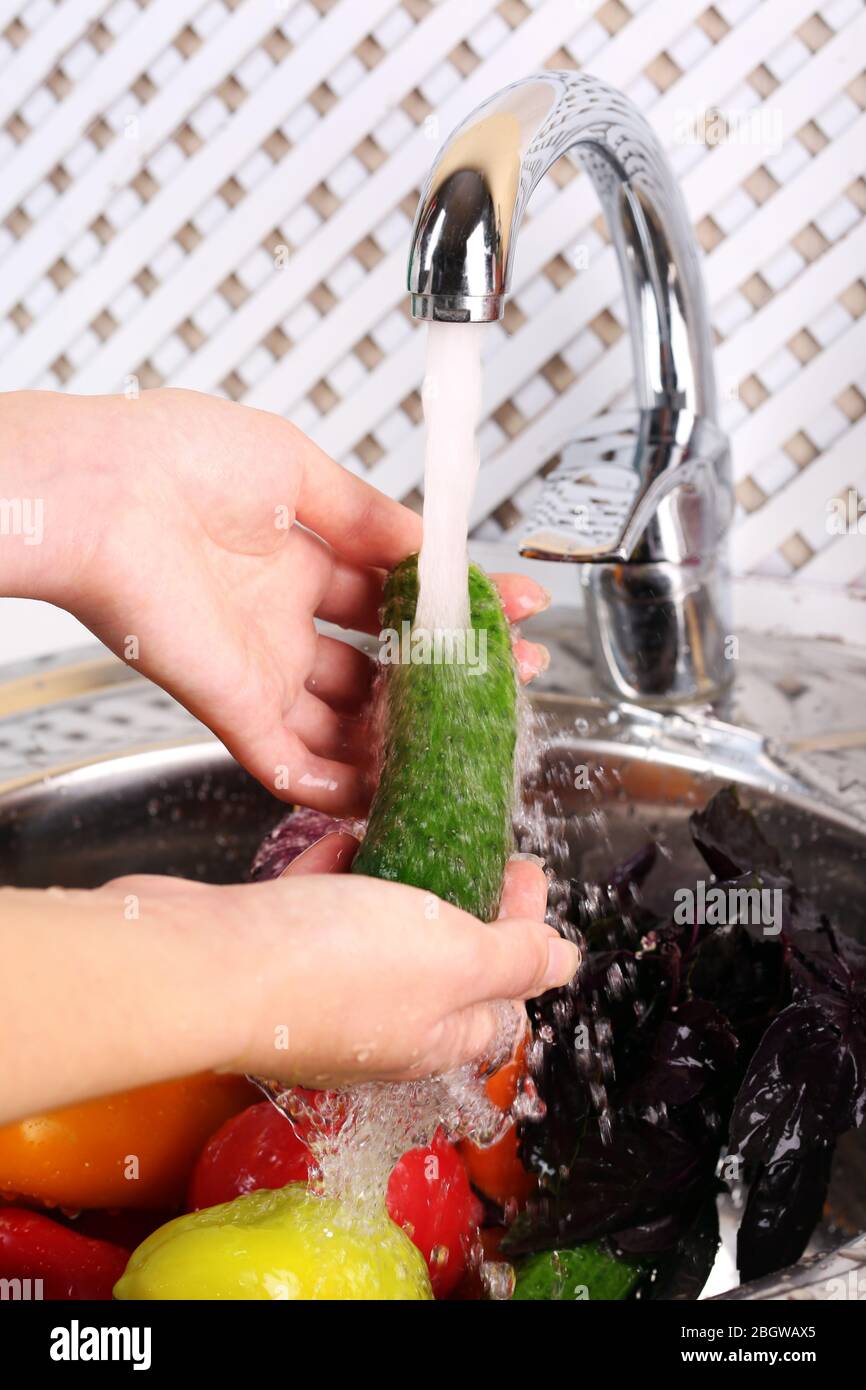 Woman washing various vegetables hi-res stock photography and images ...