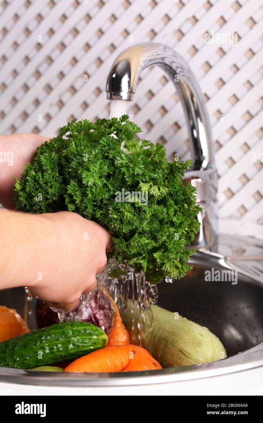 Woman washing various vegetables hi-res stock photography and images ...
