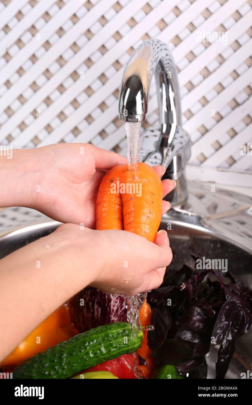 Woman washing various vegetables hi-res stock photography and images ...