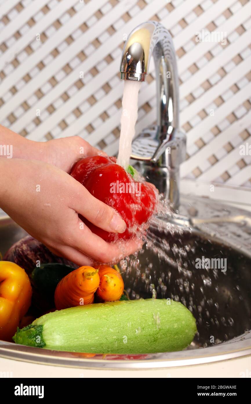 Washing vegetables, close-up Stock Photo - Alamy