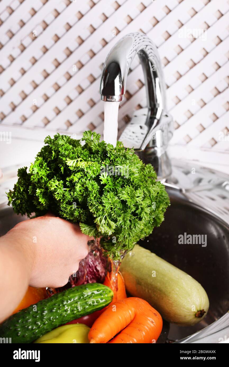 Washing vegetables, close-up Stock Photo - Alamy