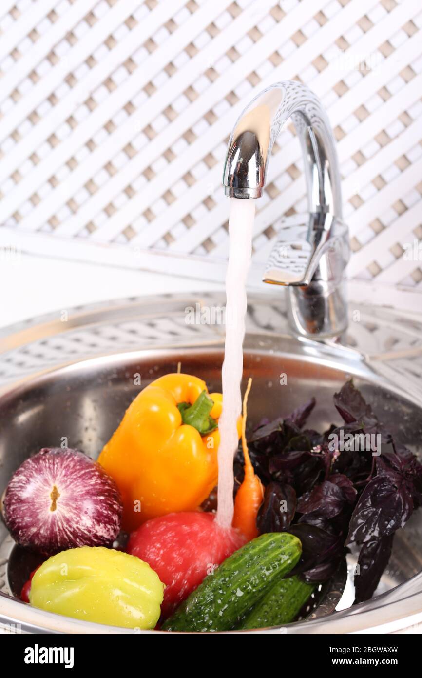 Woman washing various vegetables hi-res stock photography and images ...