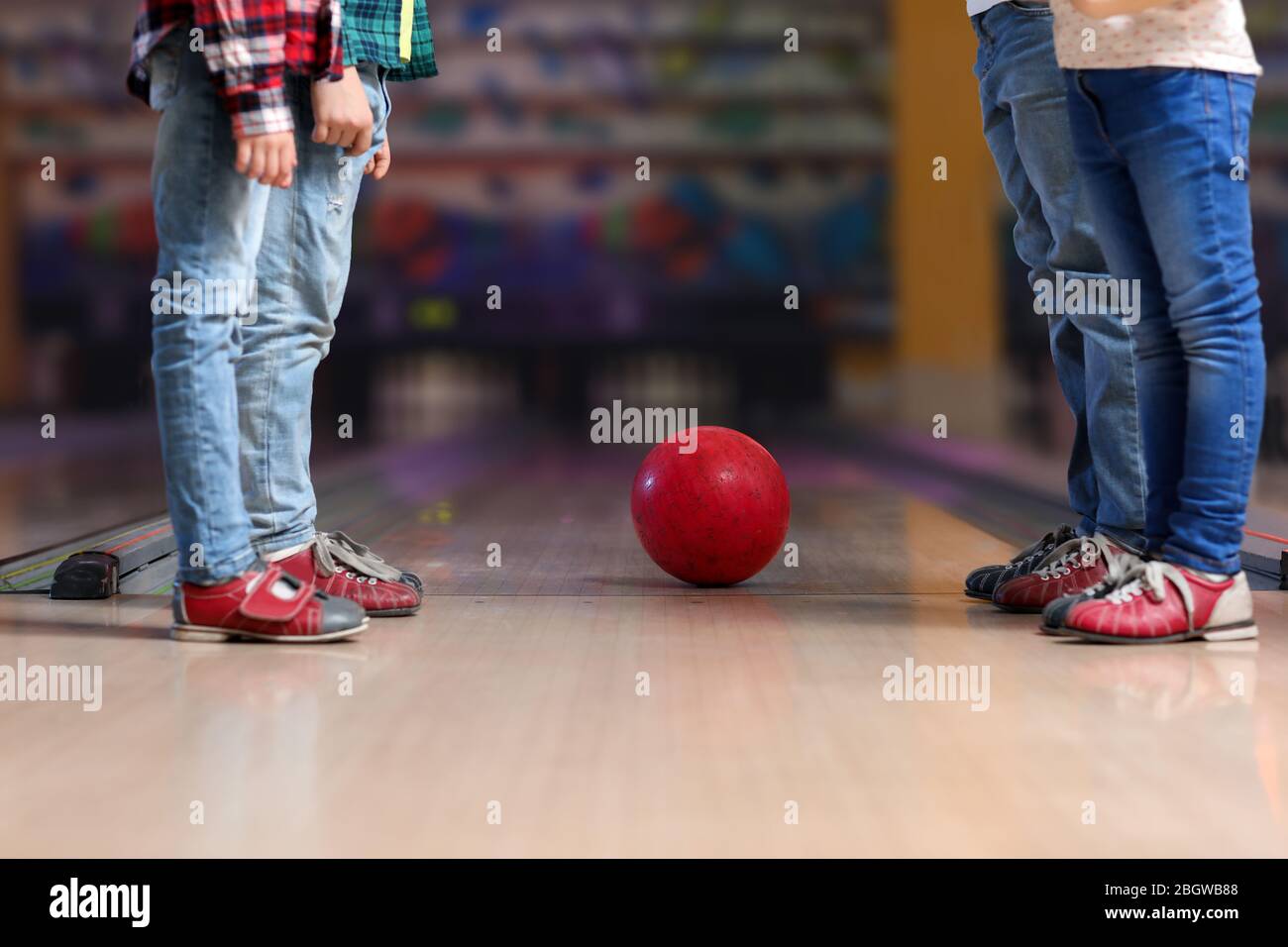 Little children playing bowling in club Stock Photo - Alamy