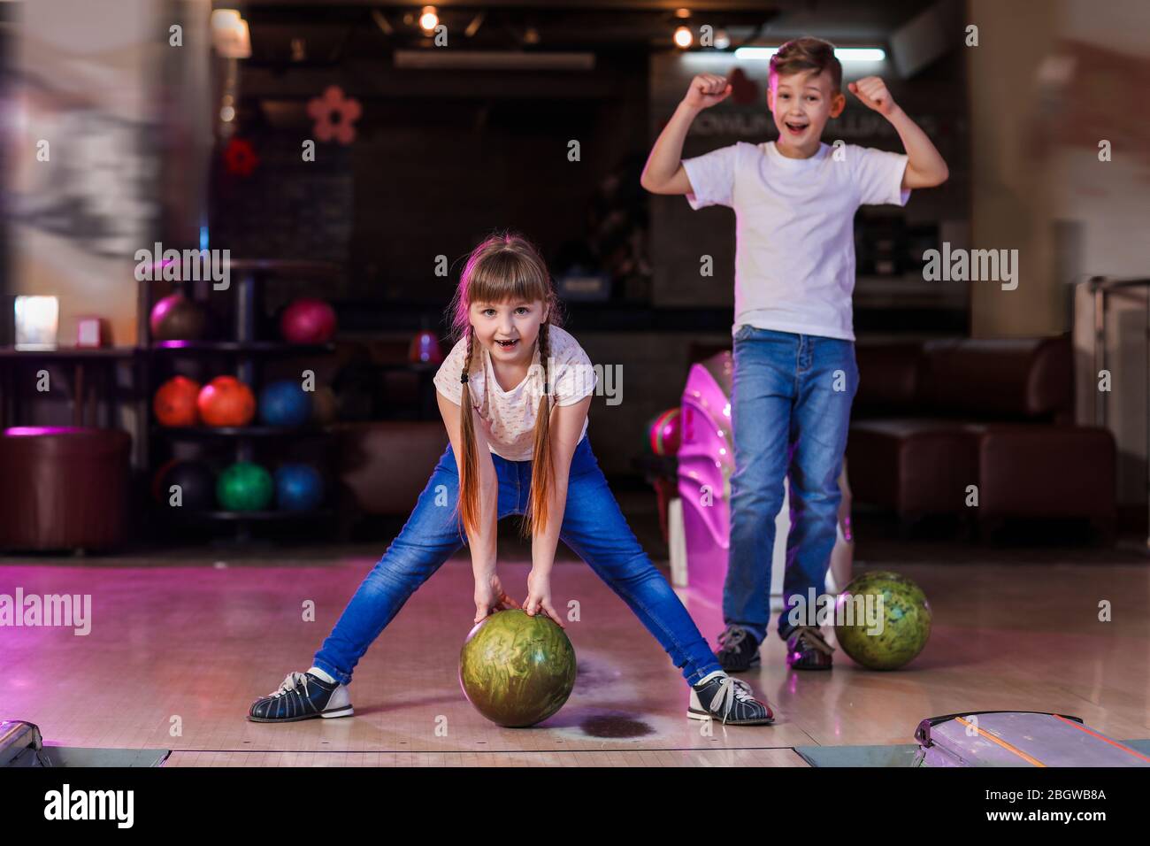 Little children playing bowling in club Stock Photo - Alamy