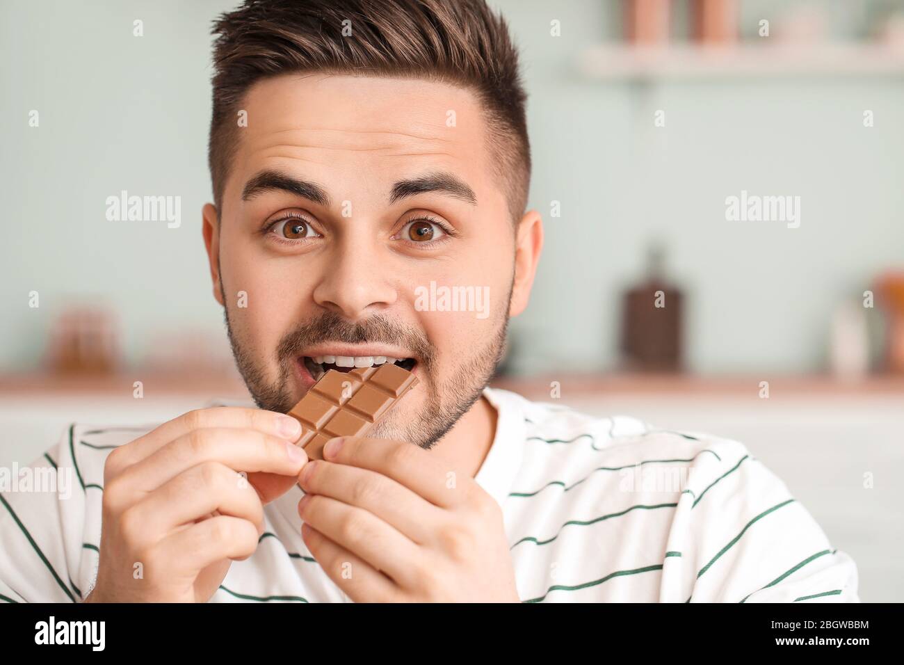 Man eating chocolate hi-res stock photography and images - Alamy