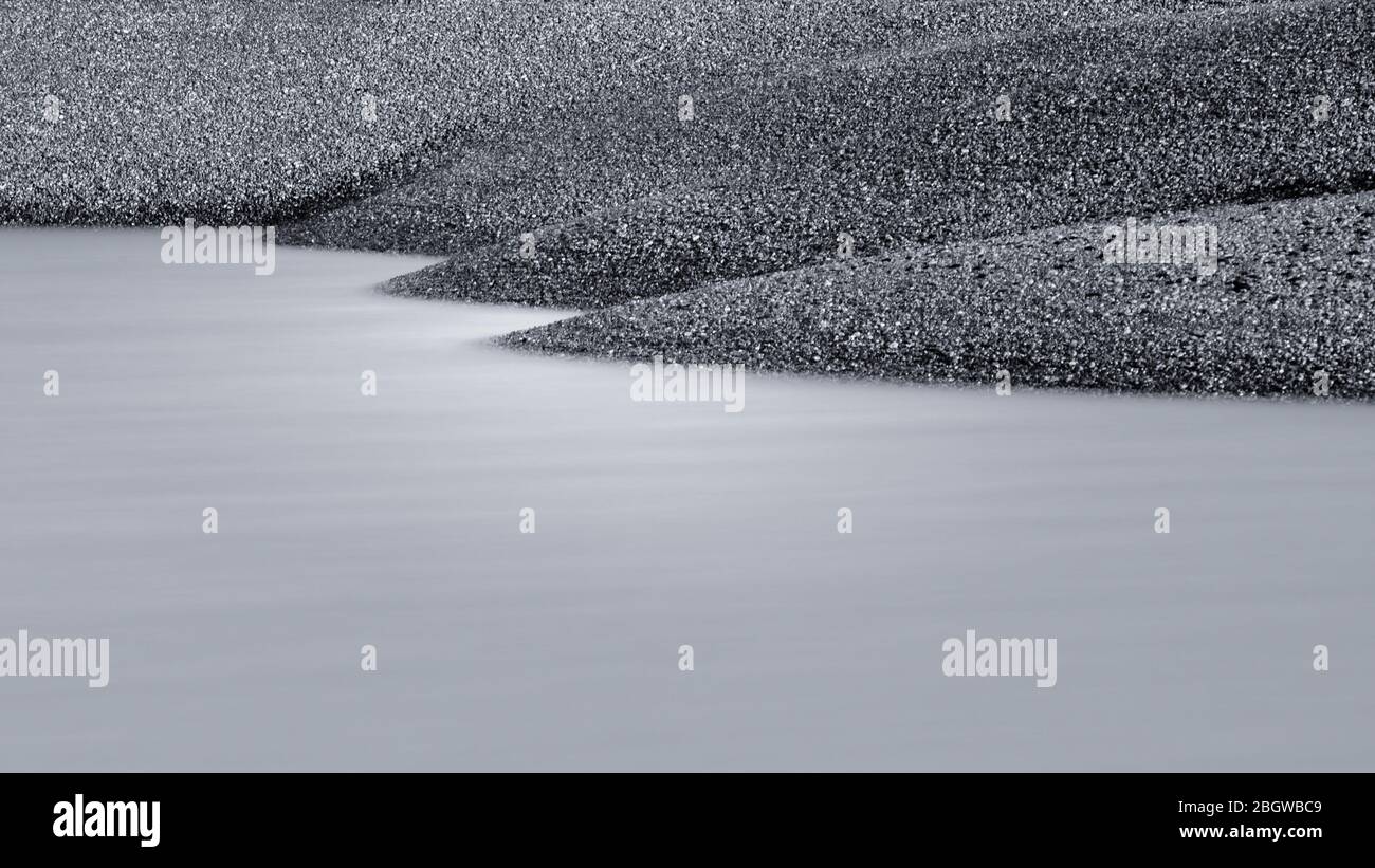 Morning at Shingle Street beach. Curving shingle shore long exposure ...