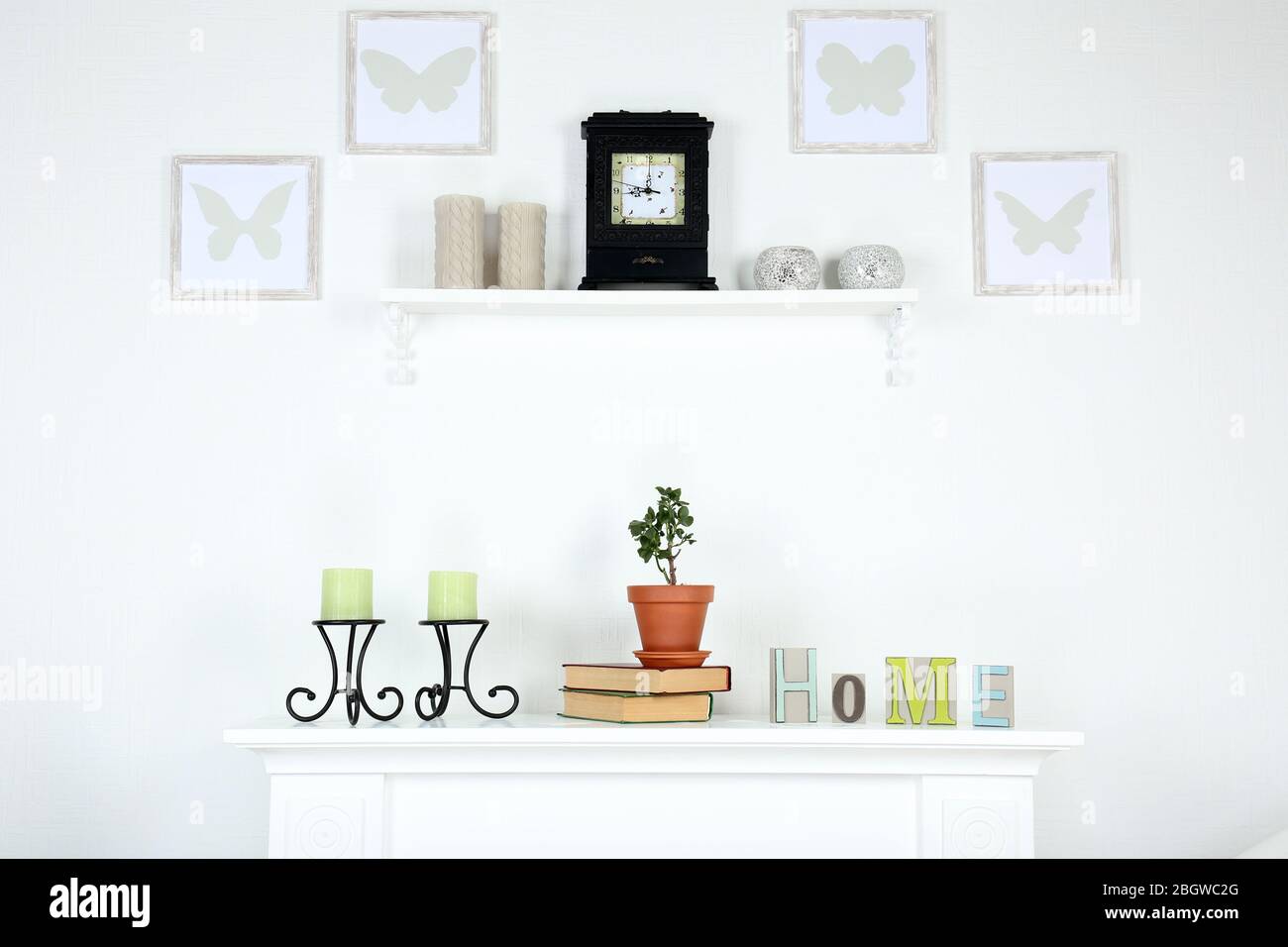 Different objects on white shelf in living room Stock Photo - Alamy