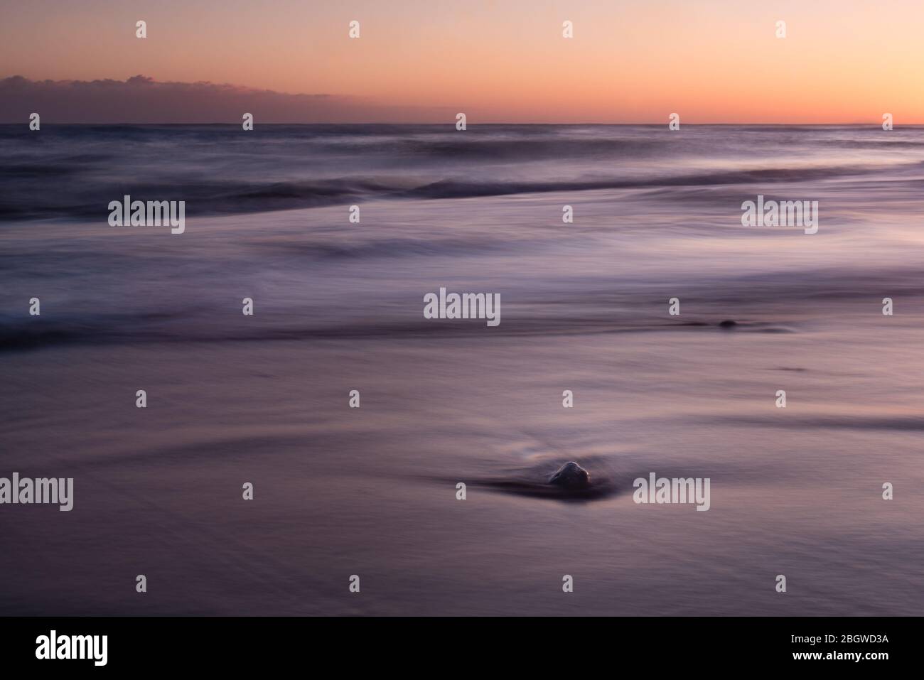 Morning at Mundesley beach. Colouful dawn over low tide beach and ...