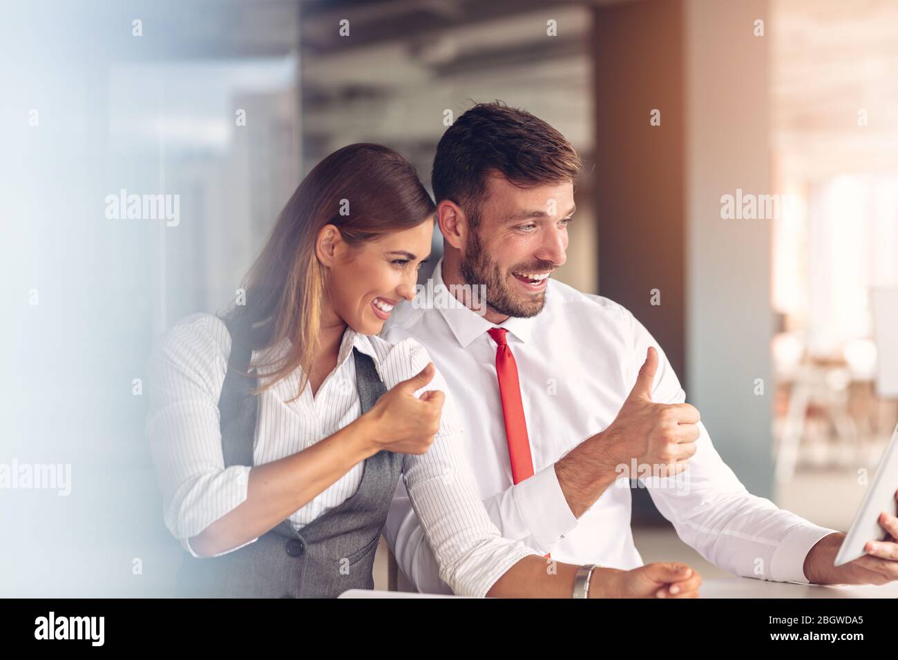 Young Business people working together on computer Stock Photo - Alamy