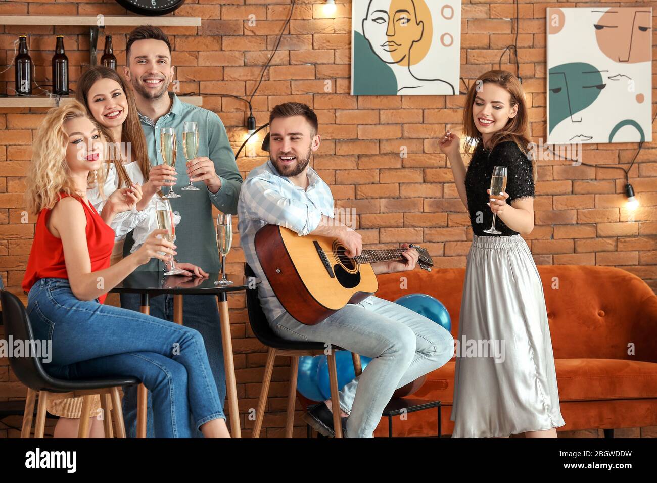 Young people having party at home Stock Photo - Alamy