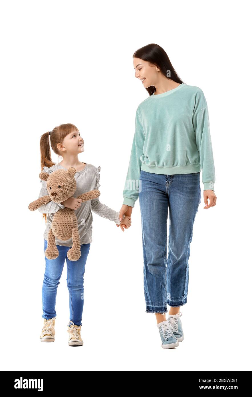 Happy woman with little adopted girl on white background Stock Photo ...