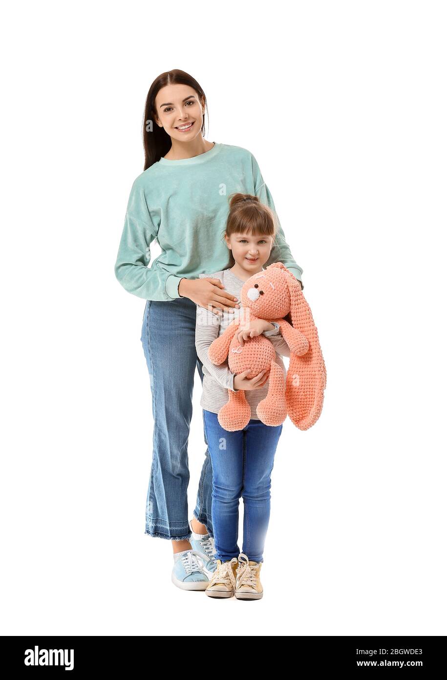 Happy woman with little adopted girl on white background Stock Photo ...