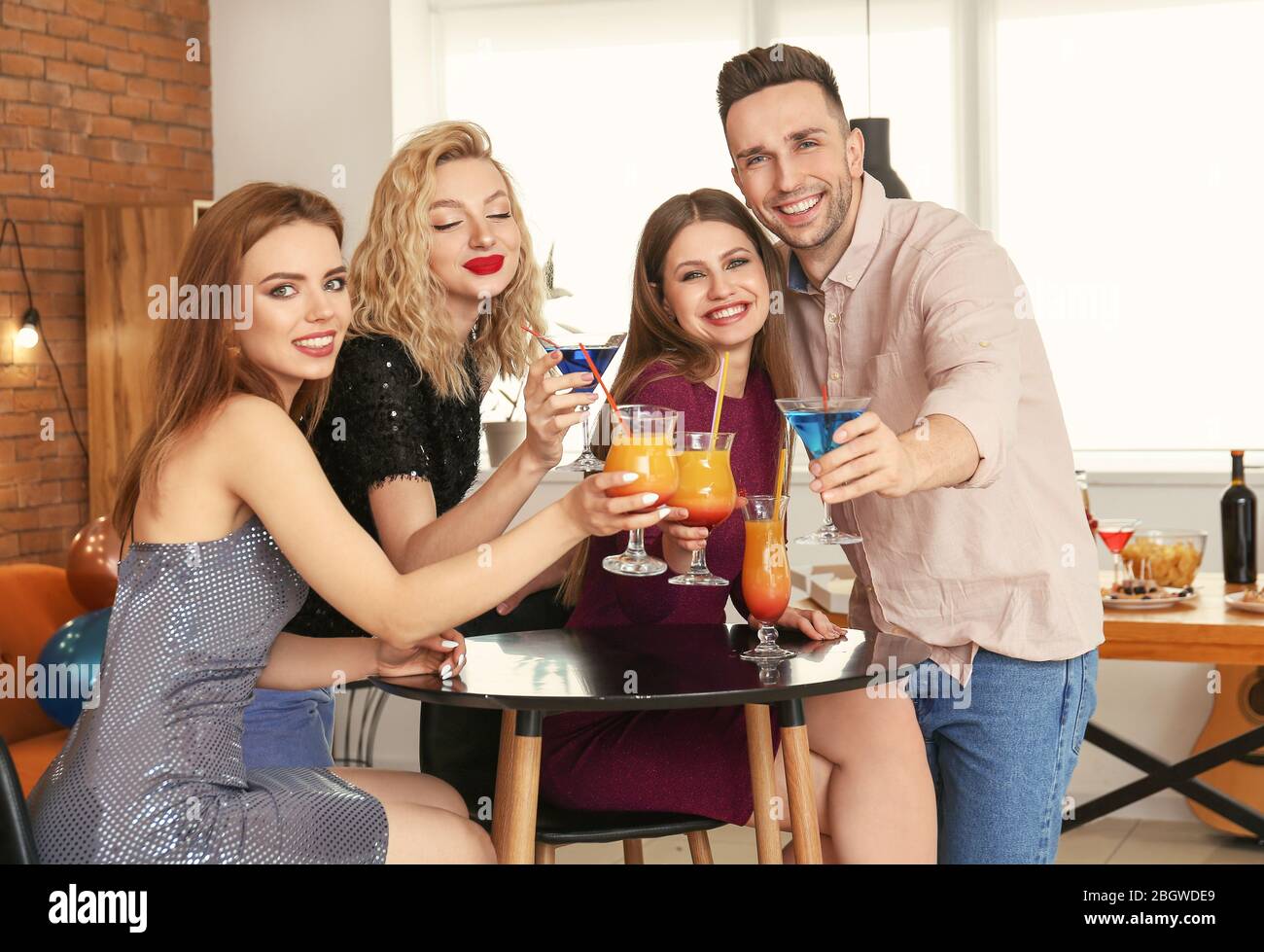 Young people having party at home Stock Photo - Alamy