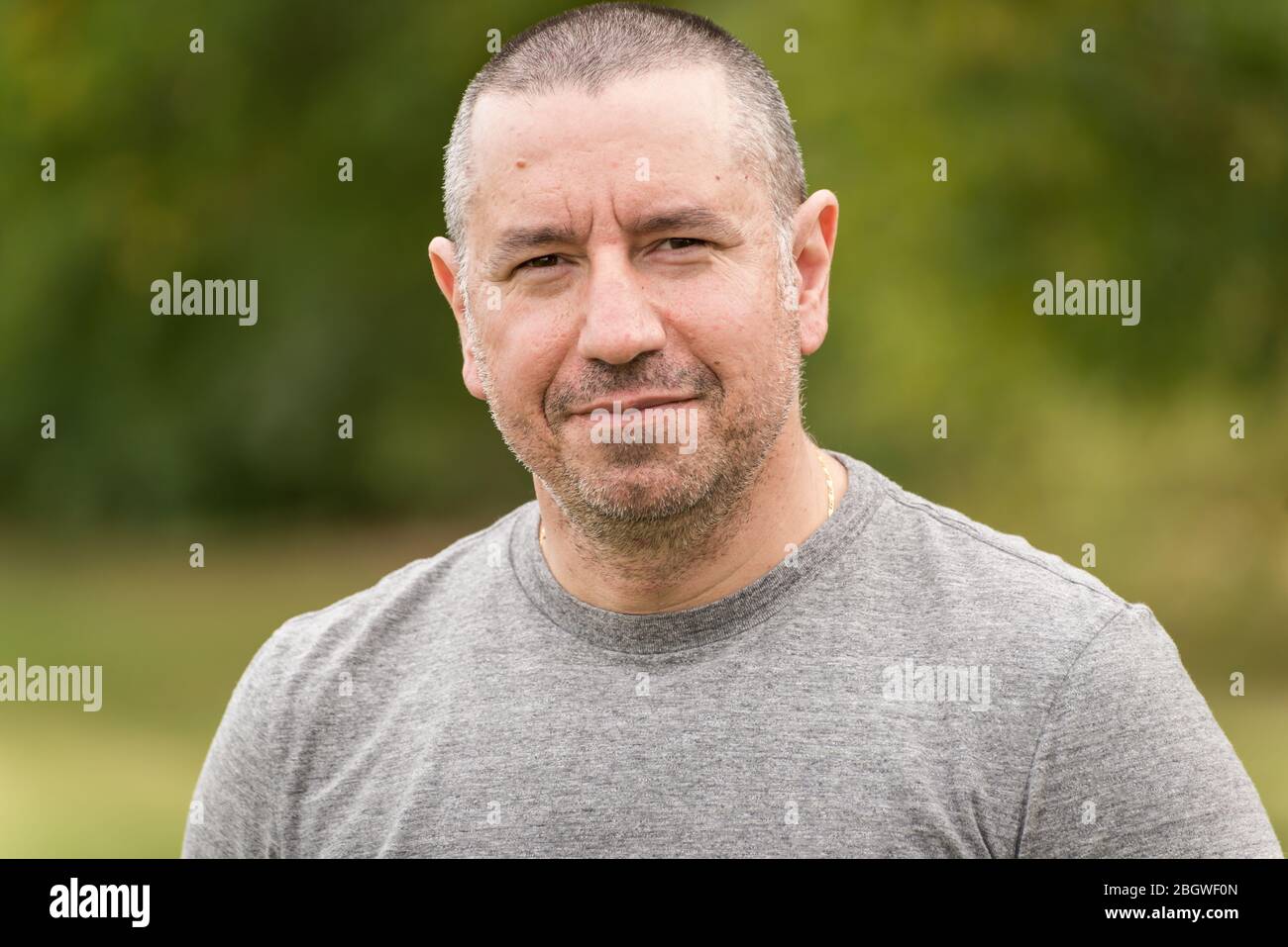 Portrait of a middle aged man with short hair, outdoor Stock Photo - Alamy
