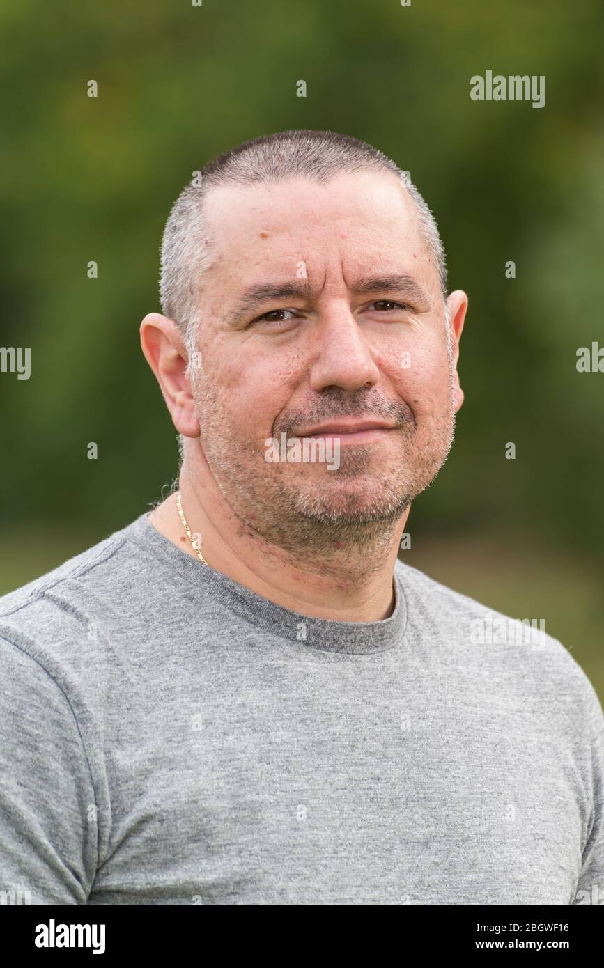 Portrait of a middle aged man with short hair, outdoor Stock Photo - Alamy