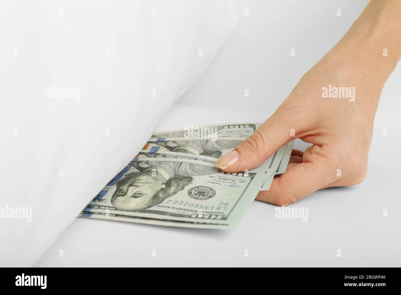 Woman hand under pillow hi-res stock photography and images - Alamy