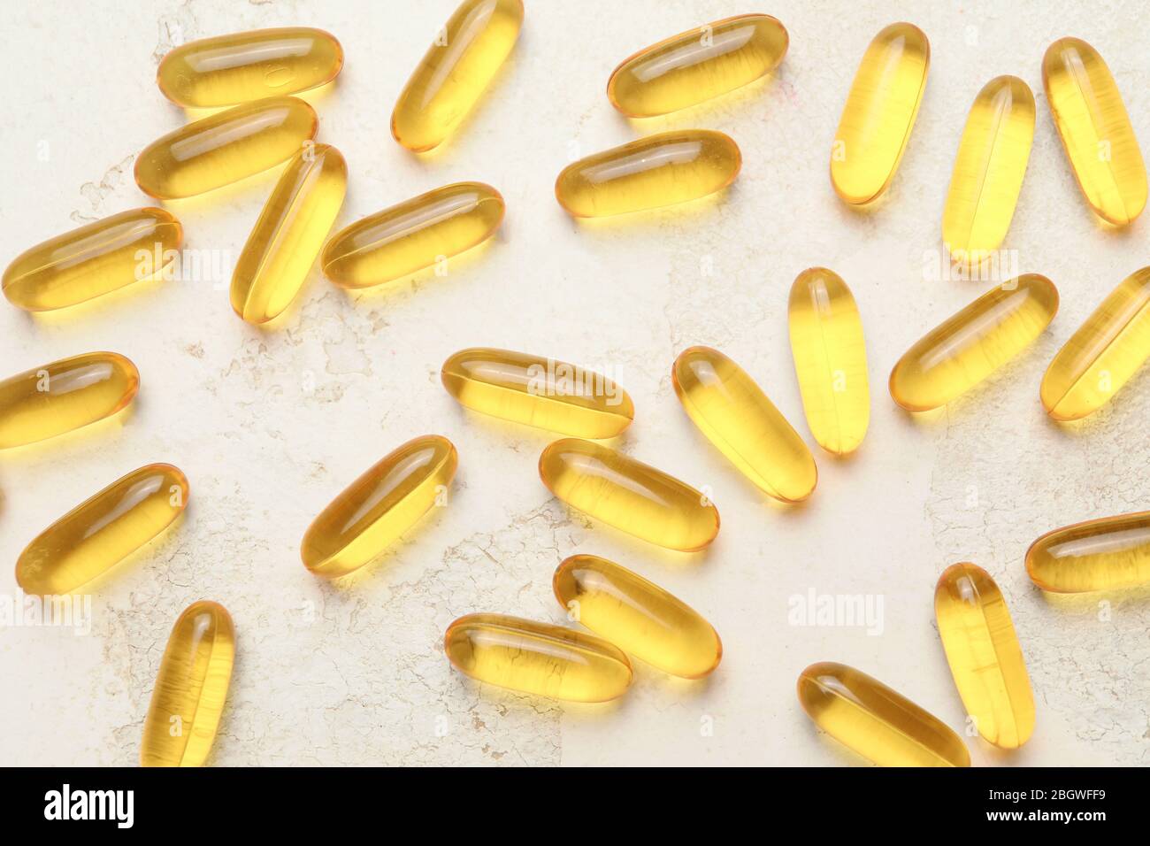 Natural supplement capsules scattered hi-res stock photography and ...