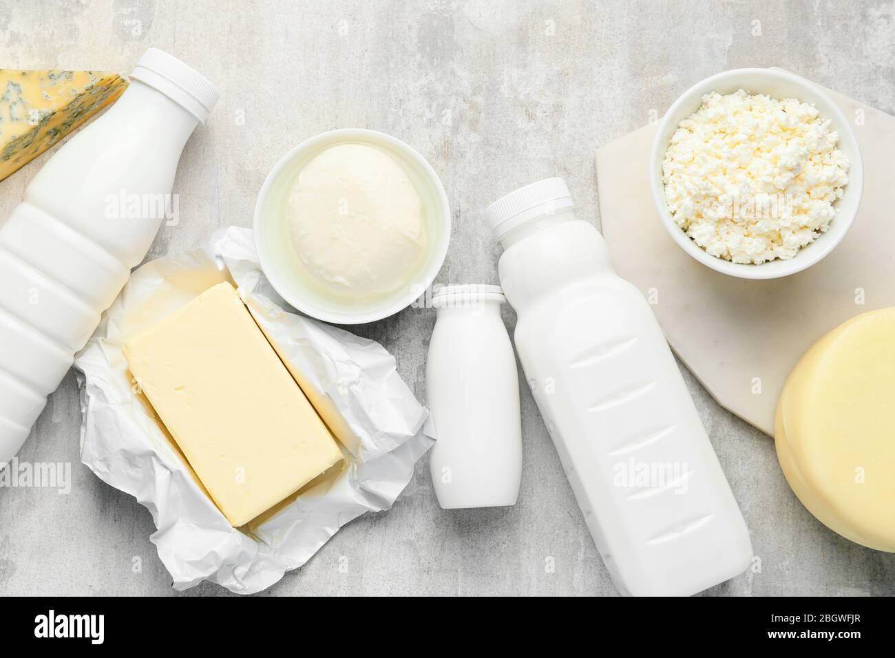 Different dairy products on grey background Stock Photo - Alamy