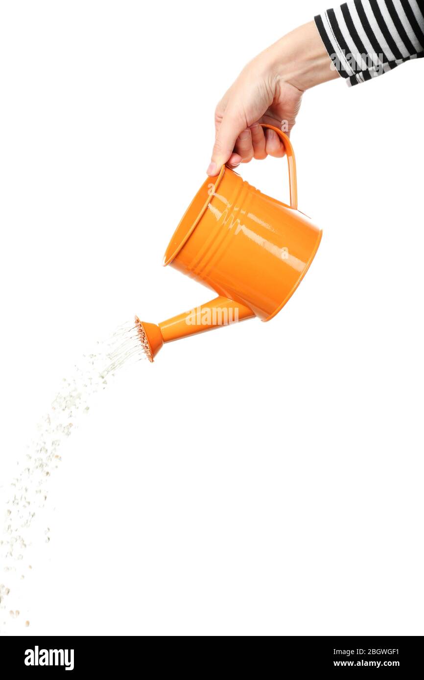 Water pouring from watering can isolated on white Stock Photo - Alamy