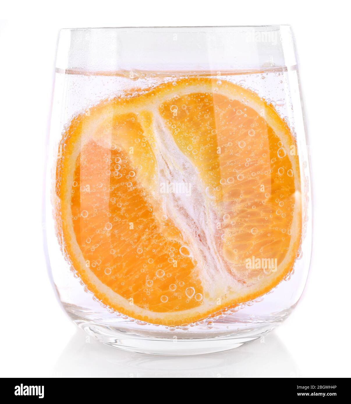 Orange in glass of water isolated on white Stock Photo - Alamy