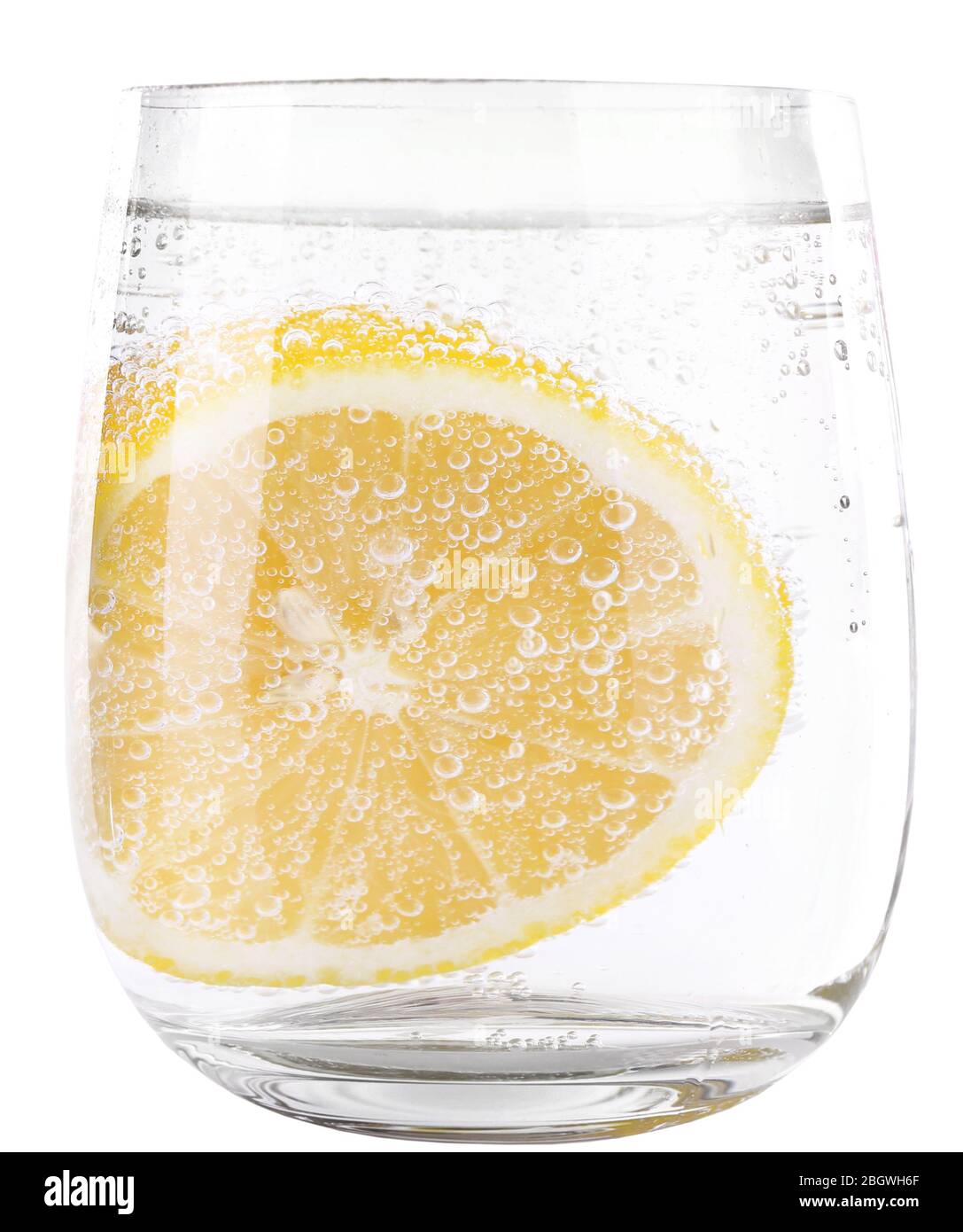 Lemon in glass of water isolated on white Stock Photo - Alamy