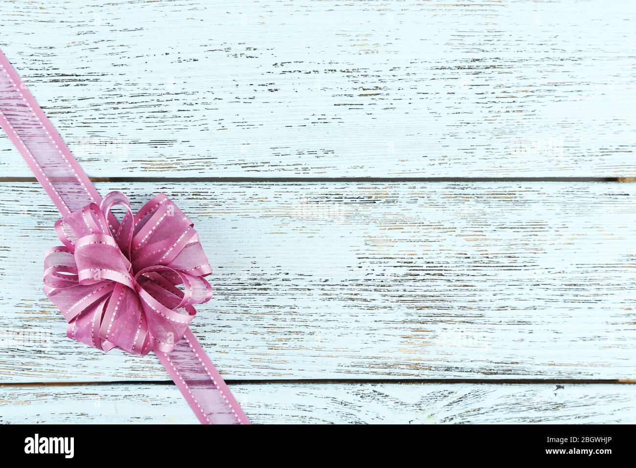 Old wooden background with beautiful bow Stock Photo - Alamy