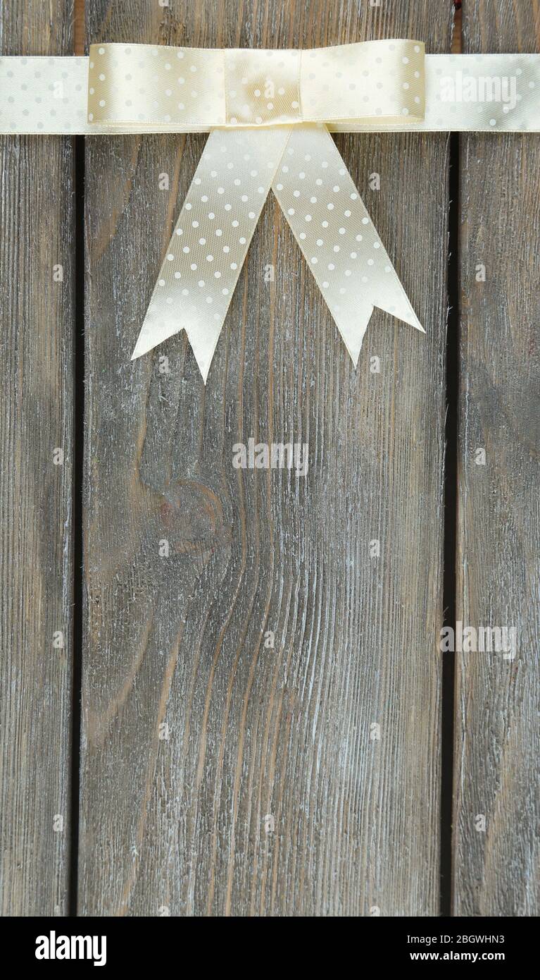 Old wooden background with beautiful bow Stock Photo - Alamy