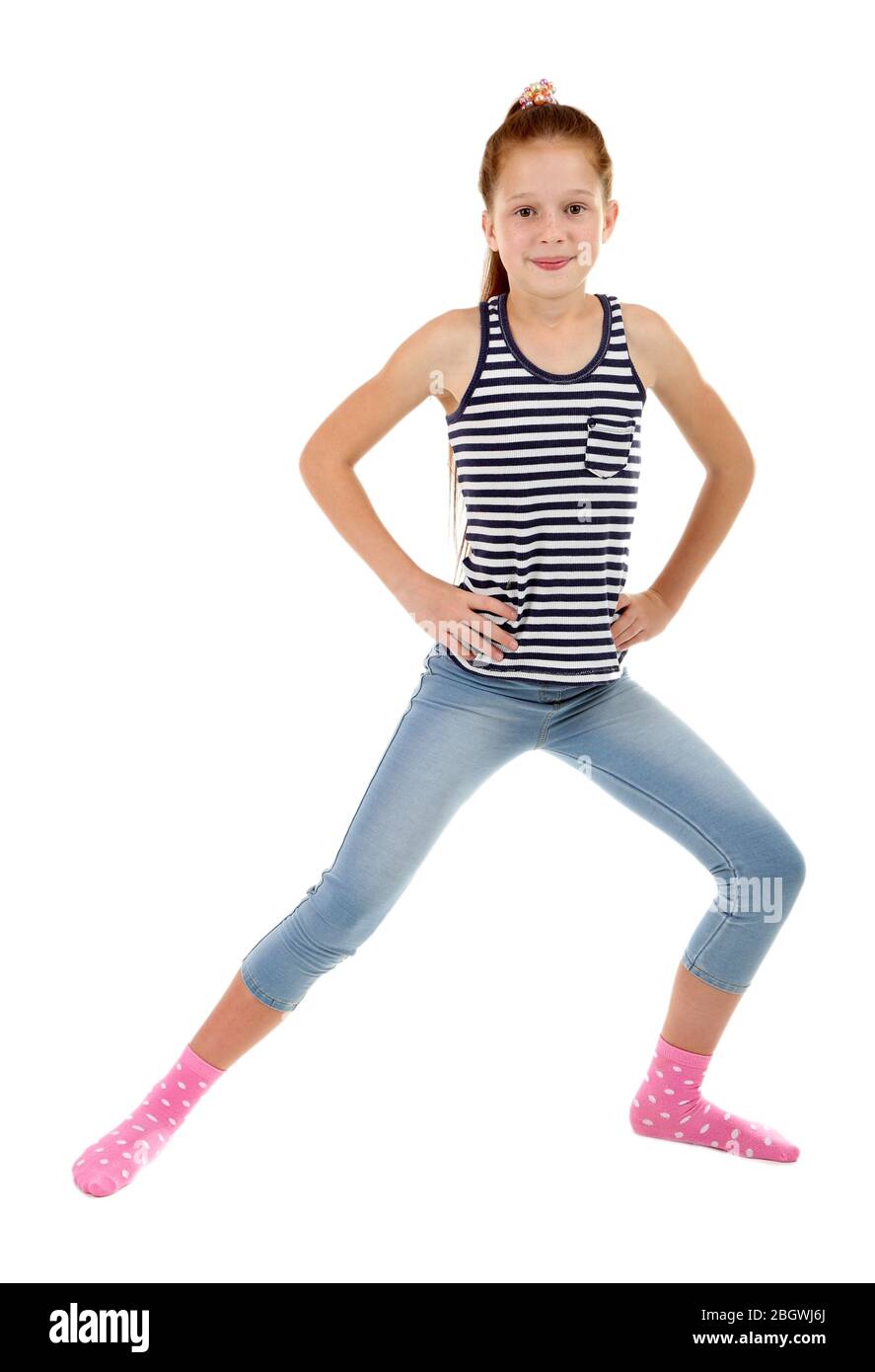 Beautiful little girl doing exercises isolated on white Stock Photo - Alamy