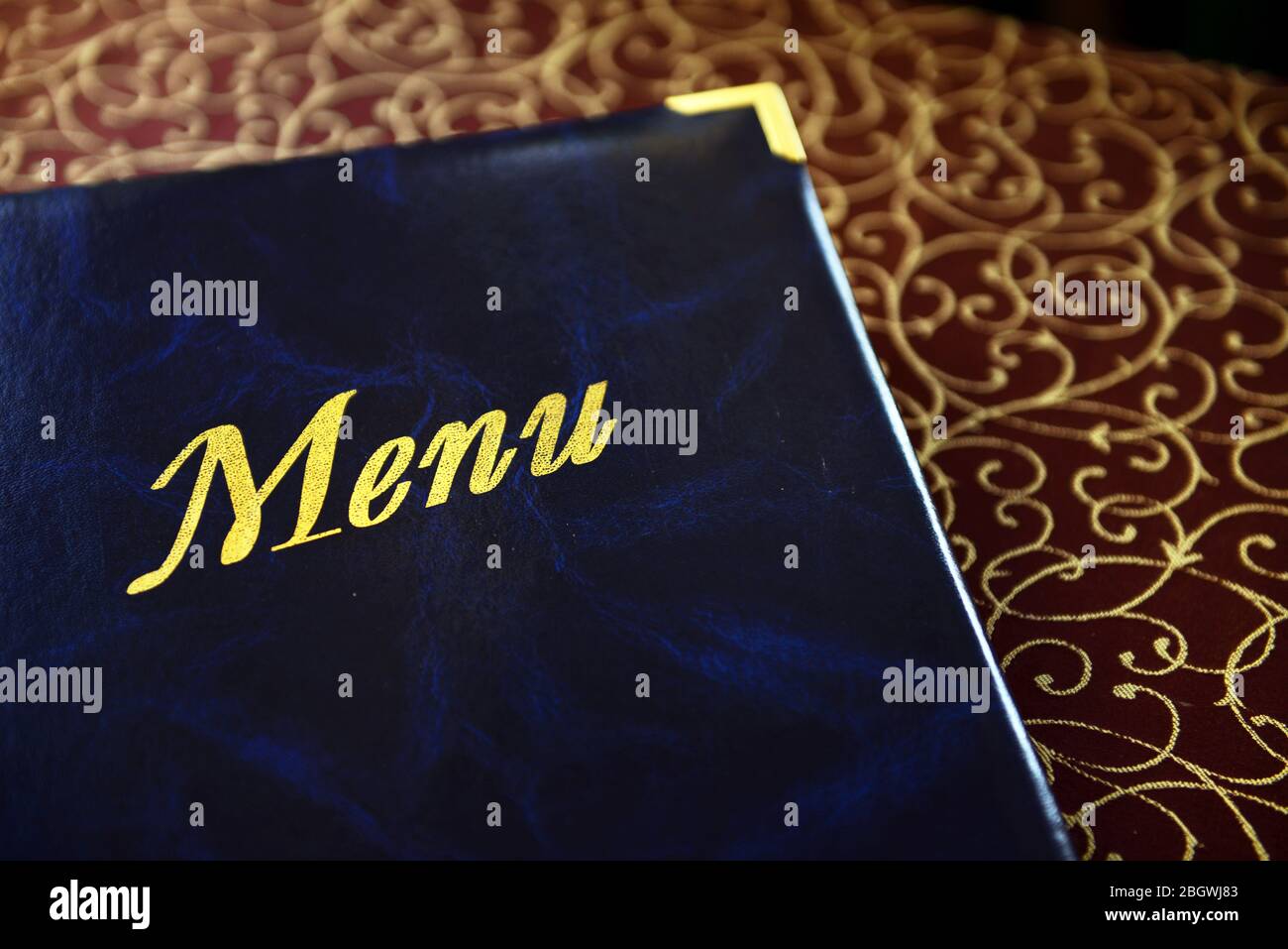 Menu book on table in restaurant Stock Photo - Alamy