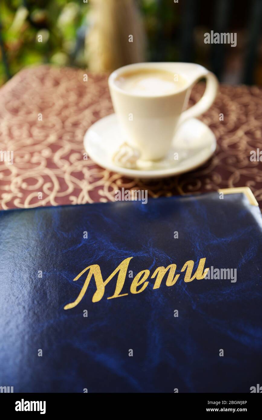 Menu book on table in restaurant Stock Photo - Alamy
