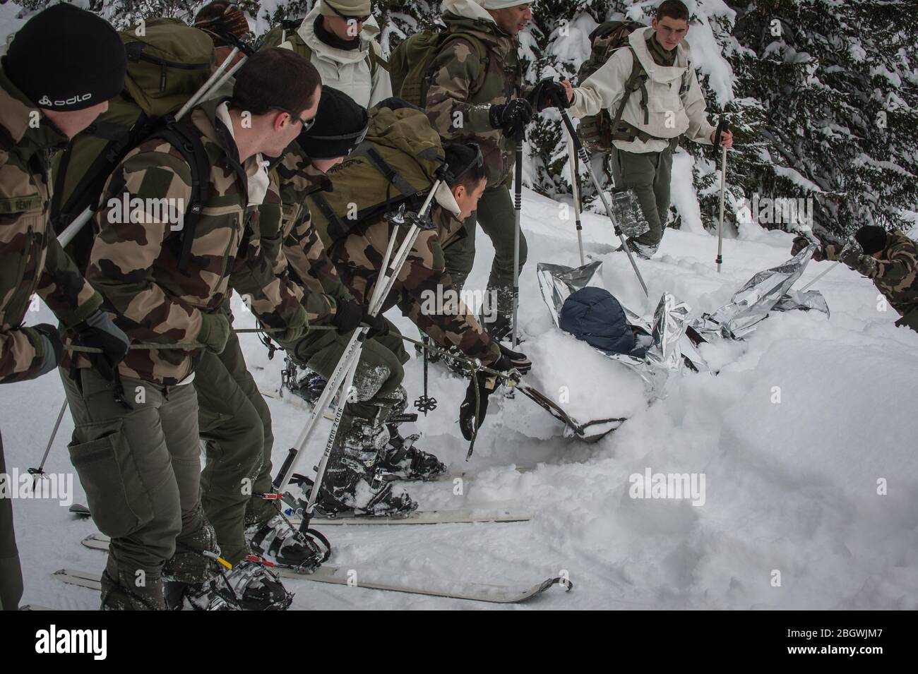 CHAMONIX, FRANCE - FEBRUARY 03: soldiers rescuing a man during a ski ...