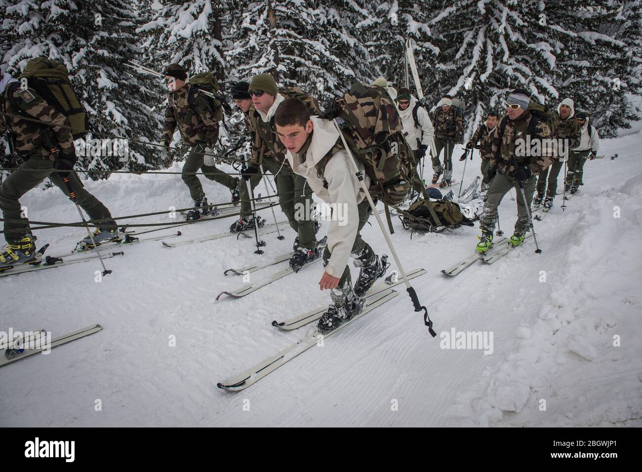 CHAMONIX, FRANCE - FEBRUARY 03: soldiers rescuing a man during a ski ...