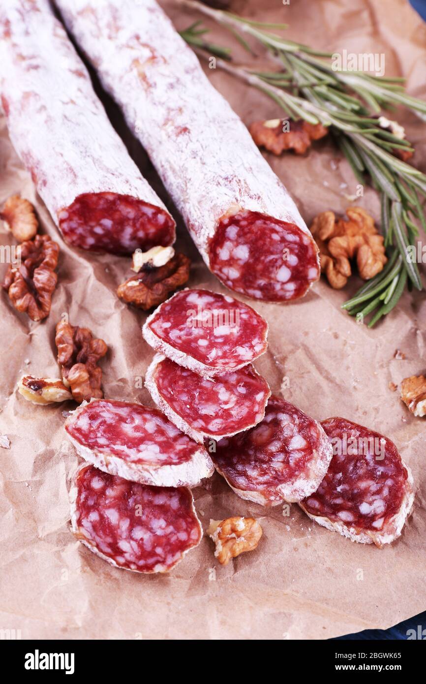 French salami and walnuts on craft paper background Stock Photo - Alamy