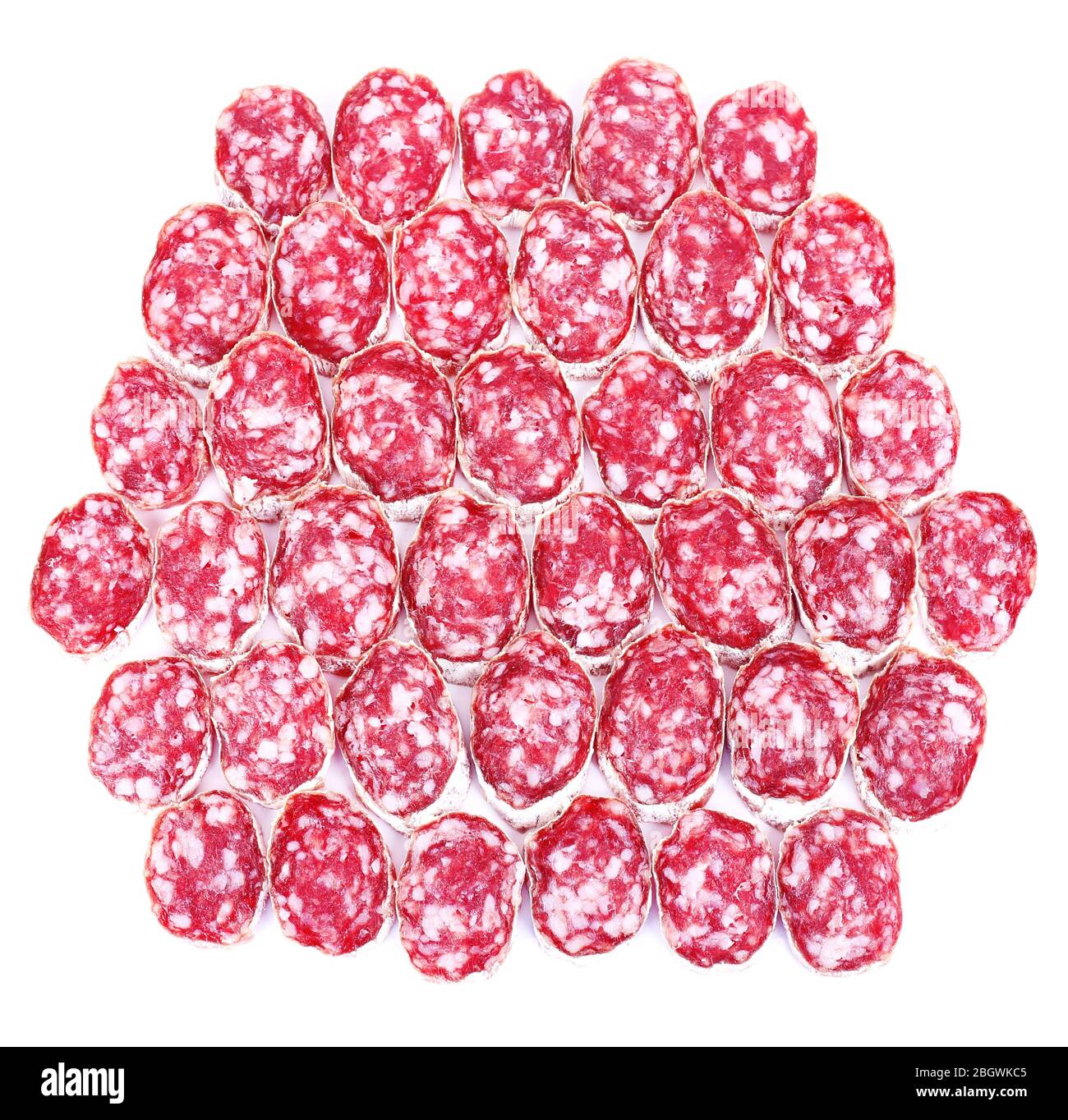 Slices of salami isolated on white Stock Photo - Alamy