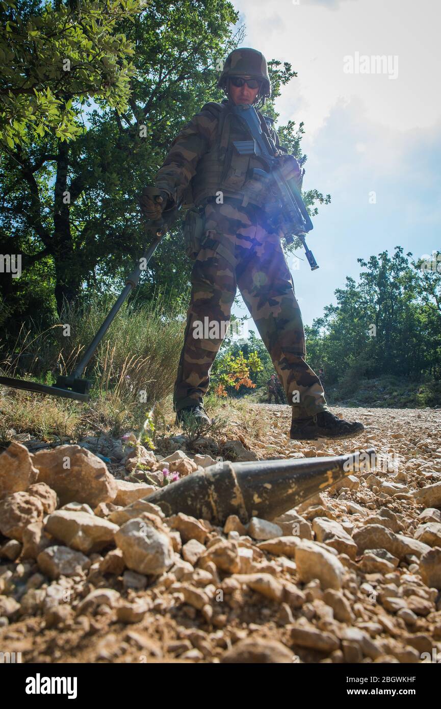 DRAGUIGNAN, FRANCE - JULY 20: a soldier trying to find fake mines ...