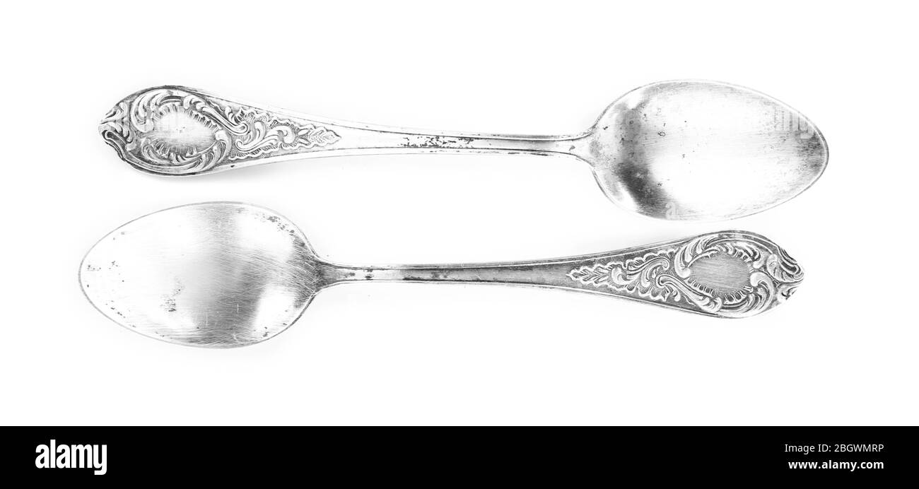 Metal spoons isolated on white Stock Photo - Alamy