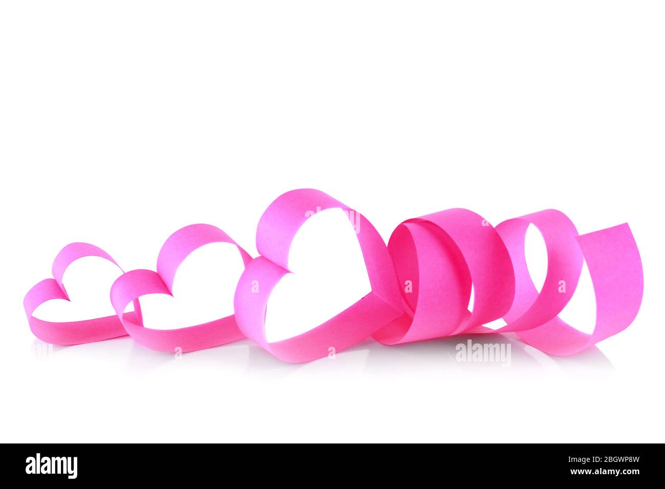 Heart shaped pink paper ribbon isolated on white Stock Photo - Alamy