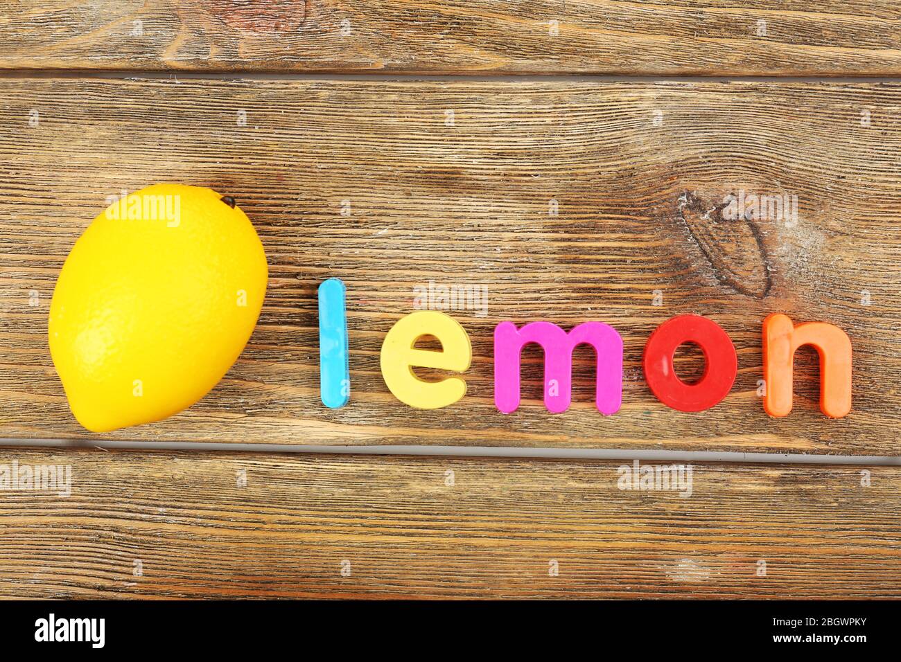 Lemon word formed with colorful letters on wooden background Stock ...