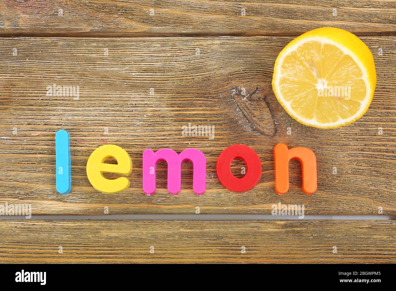 Lemon word formed with colorful letters on wooden background Stock ...