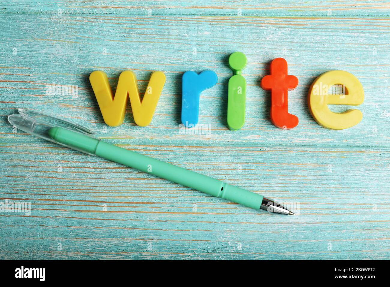 Write word formed with colorful letters on wooden background Stock ...