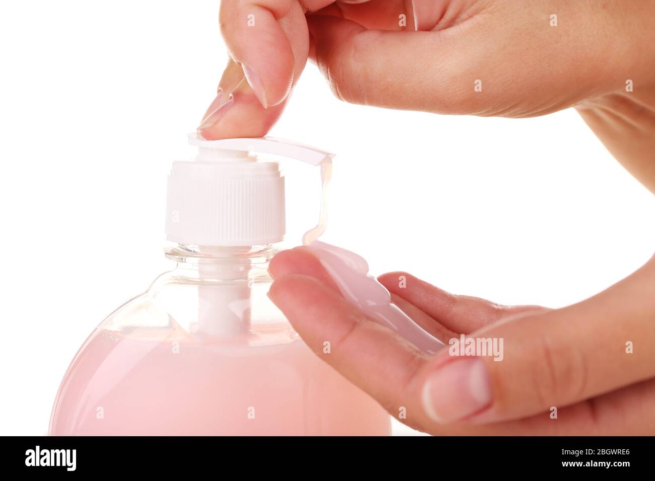 Female hands using liquid soap isolated on white Stock Photo - Alamy