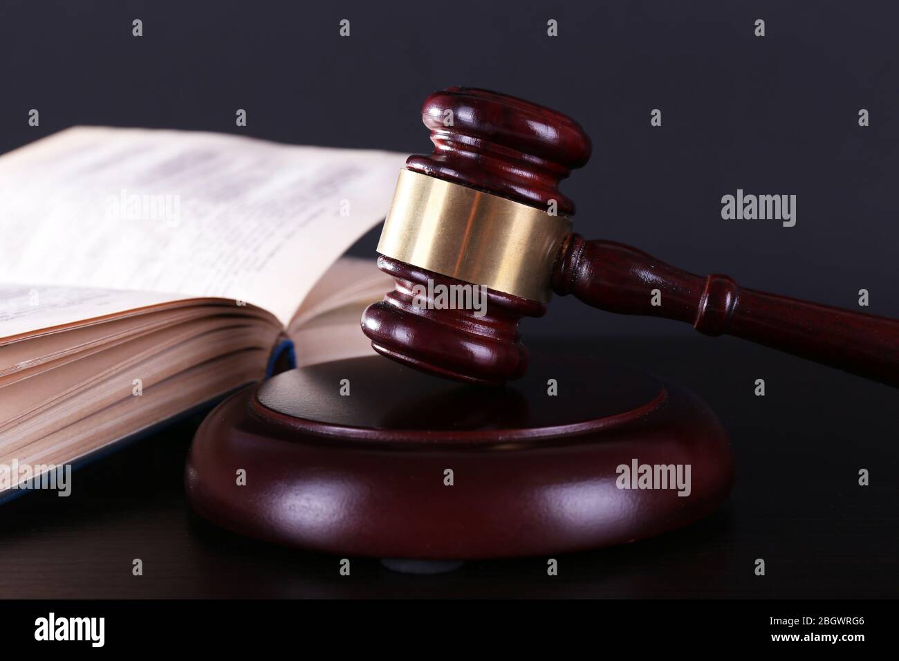 Judge's gavel and open book on dark grey background Stock Photo - Alamy