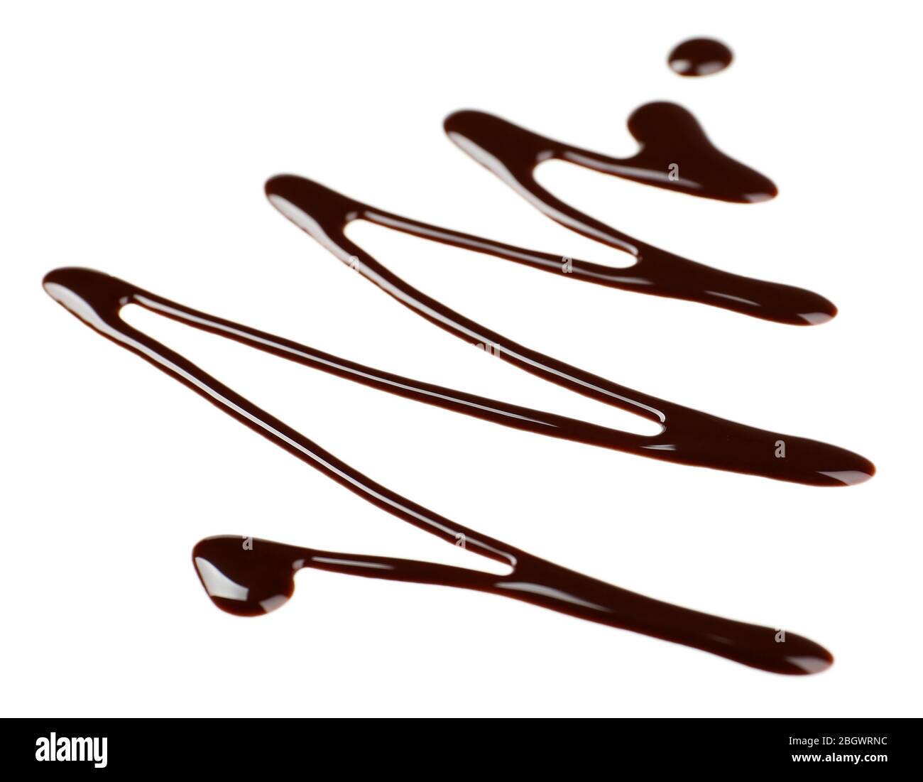 Chocolate syrup drips isolated on white Stock Photo - Alamy