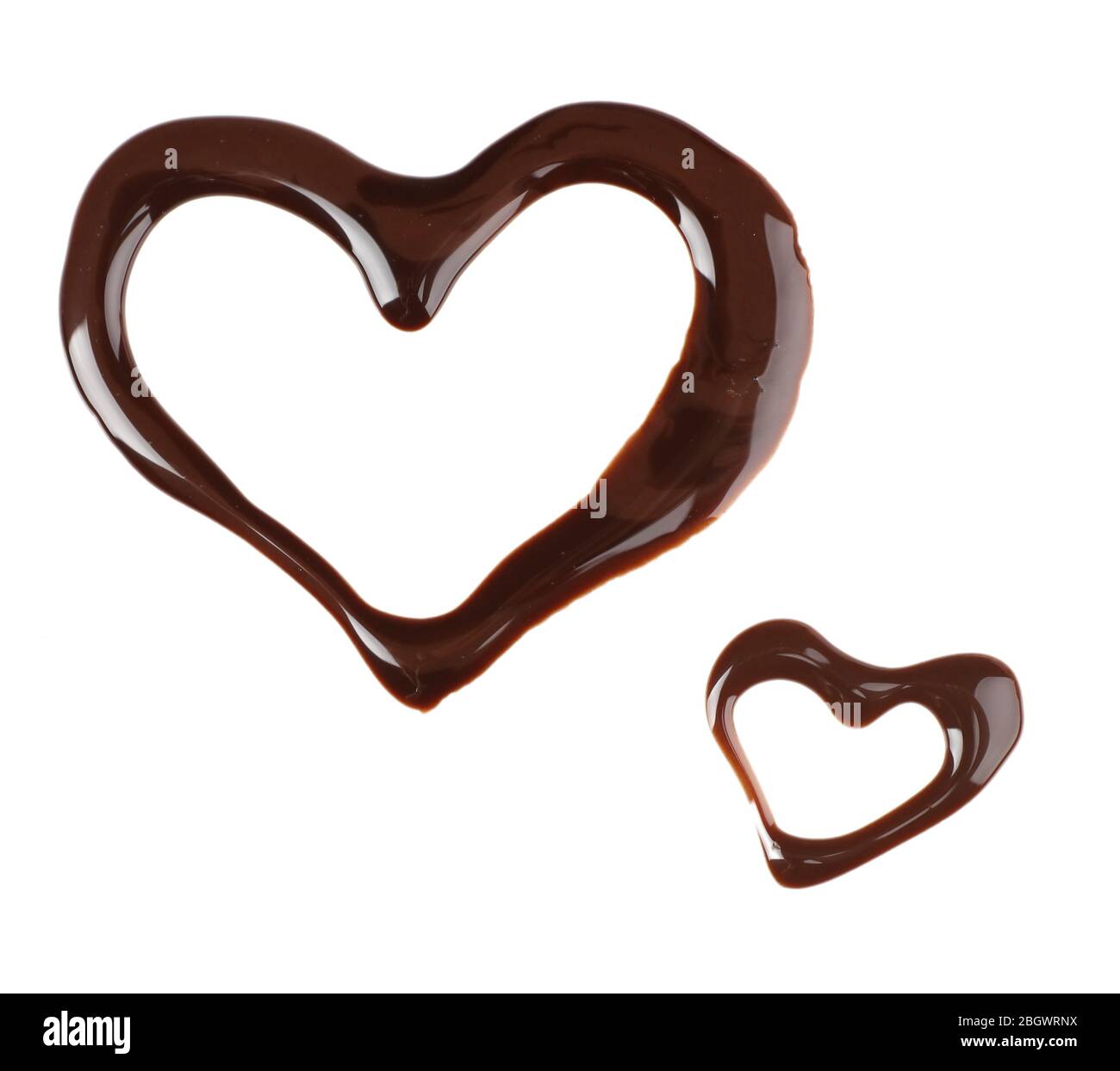Chocolate syrup drips in shape of heart isolated on white Stock Photo ...