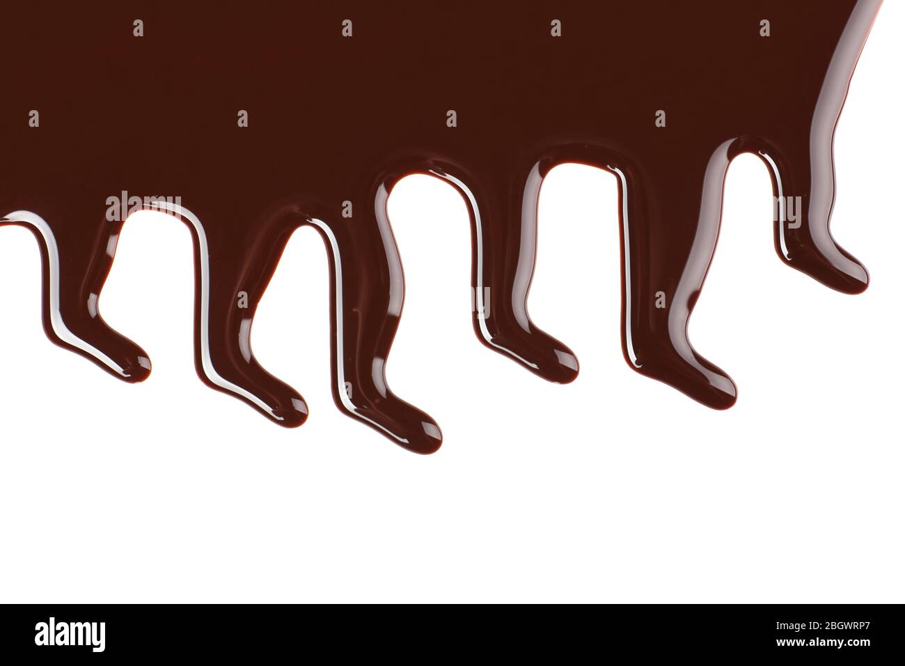 Melted chocolate dripping on white background Stock Photo - Alamy
