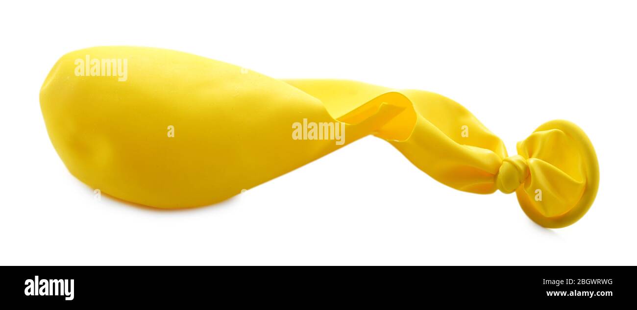 Popped yellow balloon isolated on white Stock Photo - Alamy