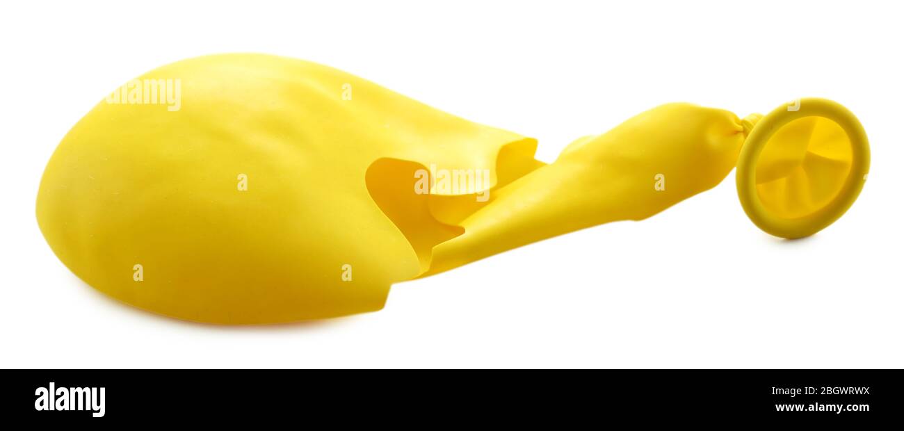 Popped yellow balloon isolated on white Stock Photo - Alamy