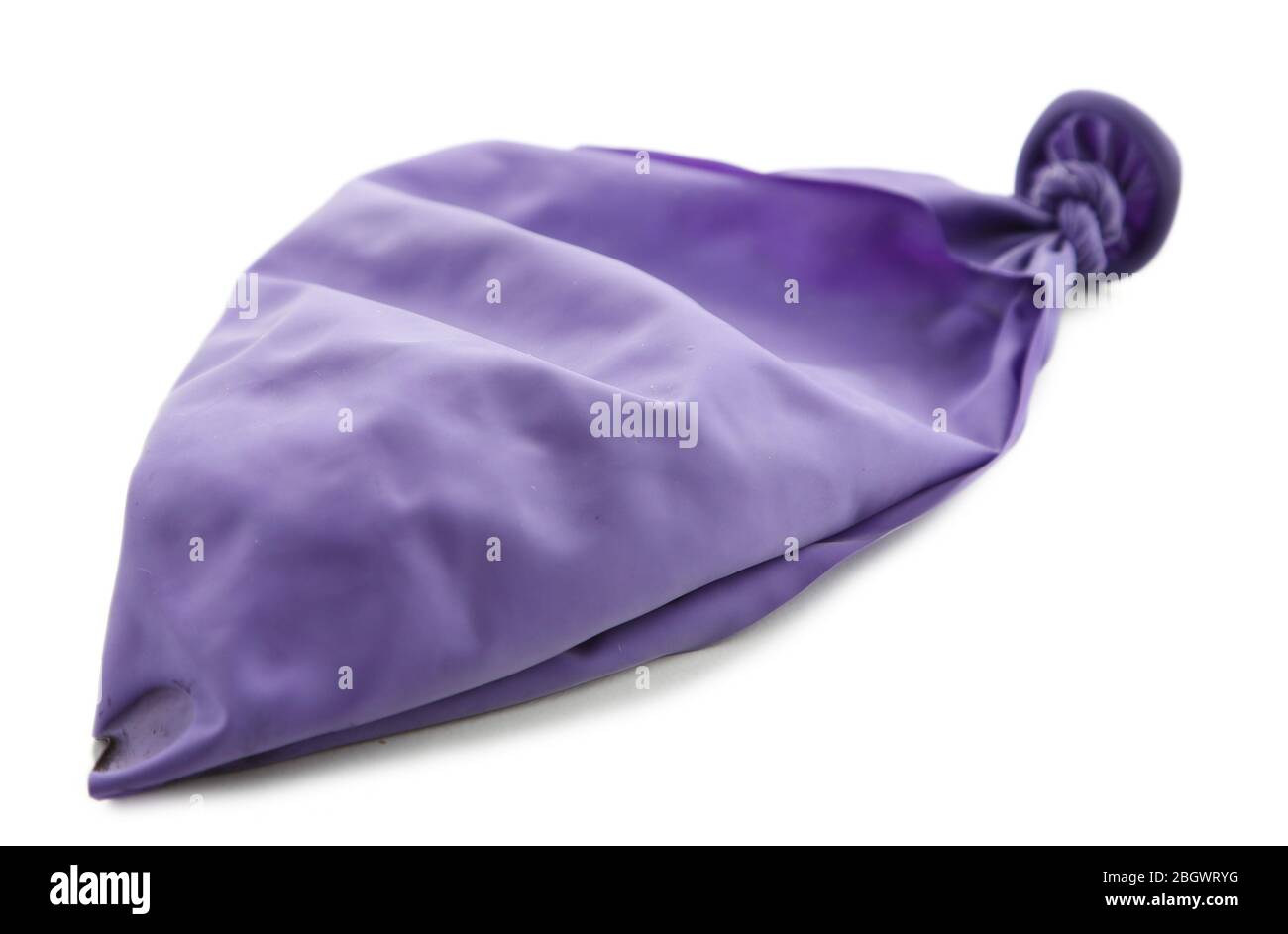Popped violet balloon isolated on white Stock Photo - Alamy