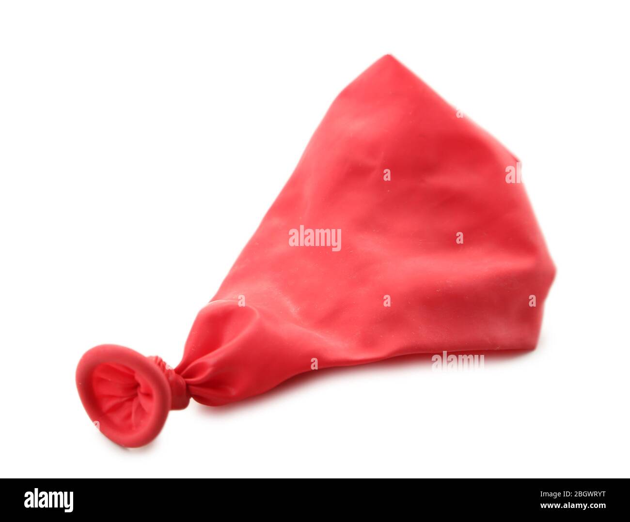 Popped red balloon isolated on white Stock Photo - Alamy